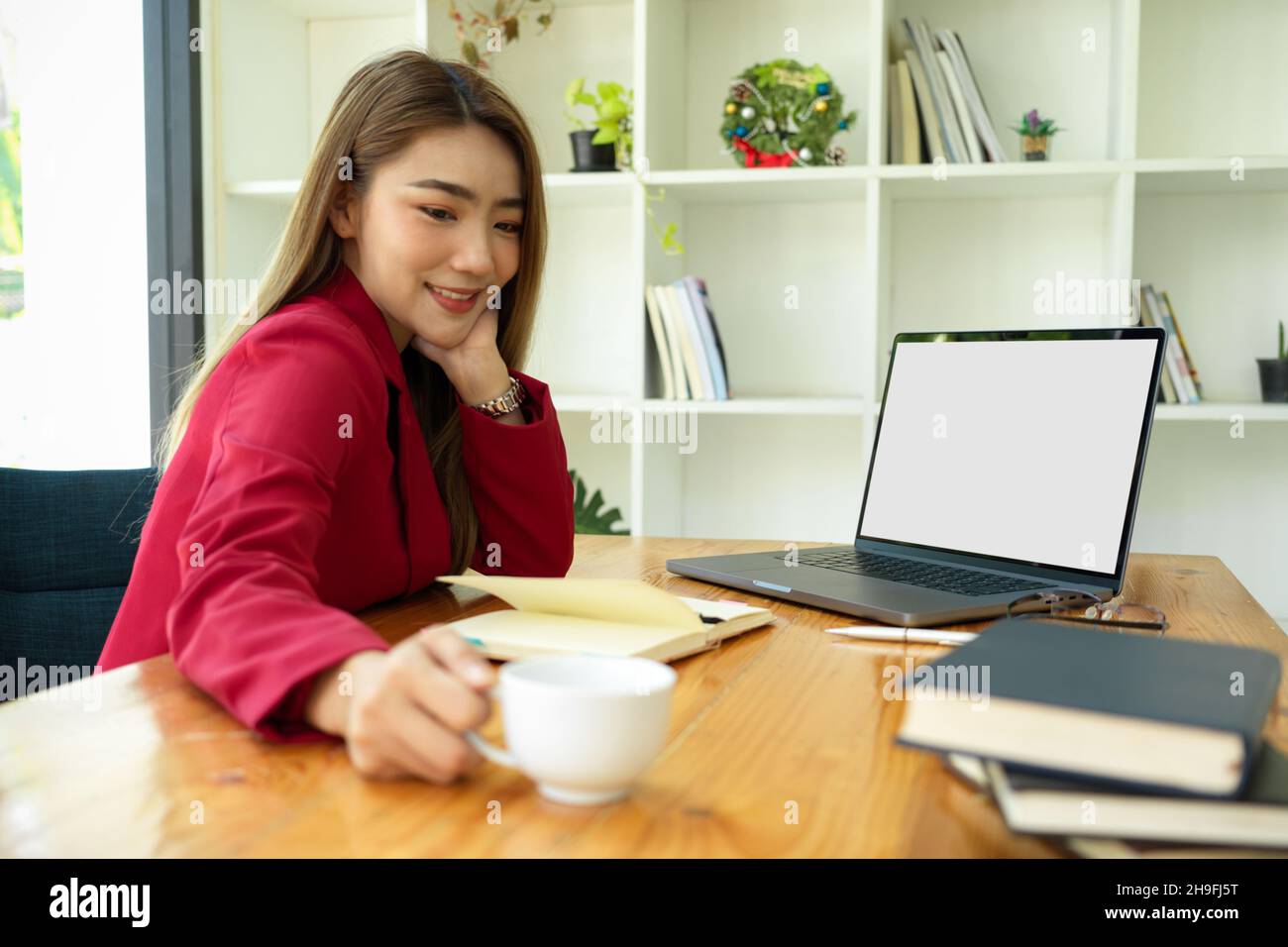 Beautiful and cheerful female entrepreneur or business owner working at ...