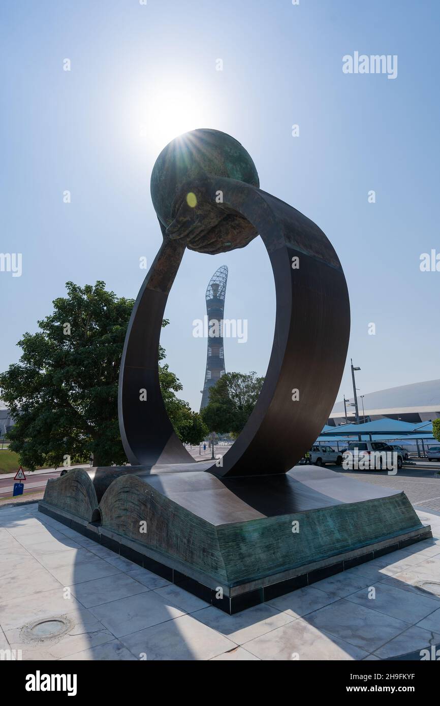 QATAR - NOV 13, 2021:A sculpture of hands rising from a book support ...