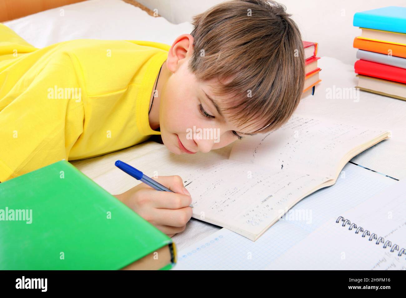 Kid doing Homework at the Home Stock Photo - Alamy