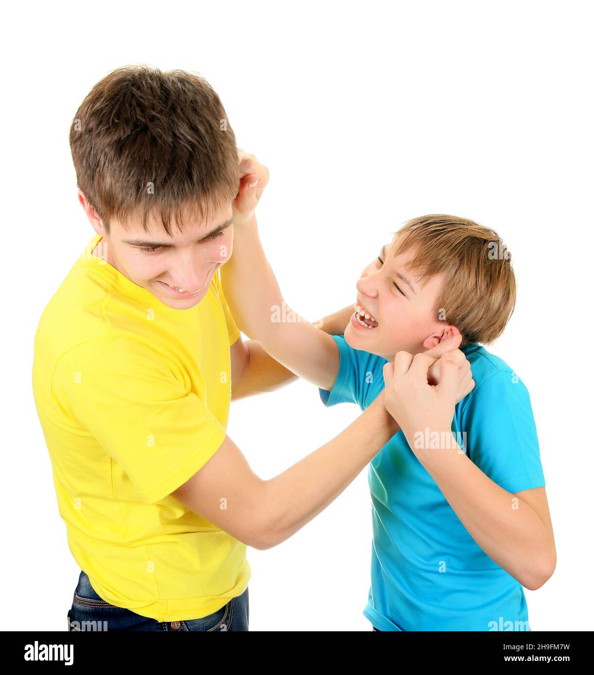 Playful Brothers fight for the Fun on the White background Stock Photo ...
