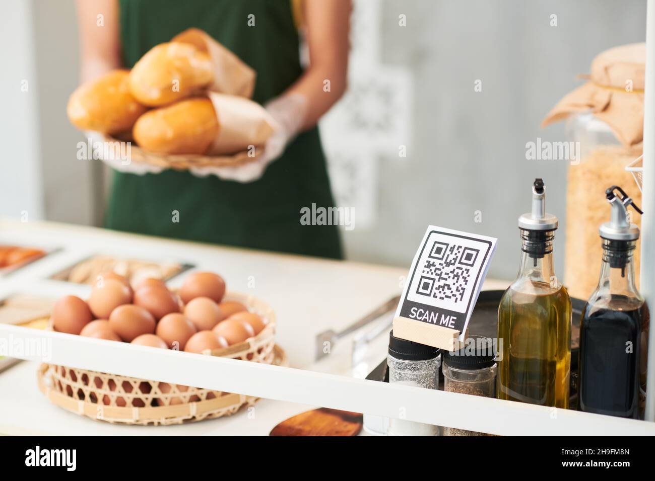 QR code for online payments on street food cart and vendor with plate ...