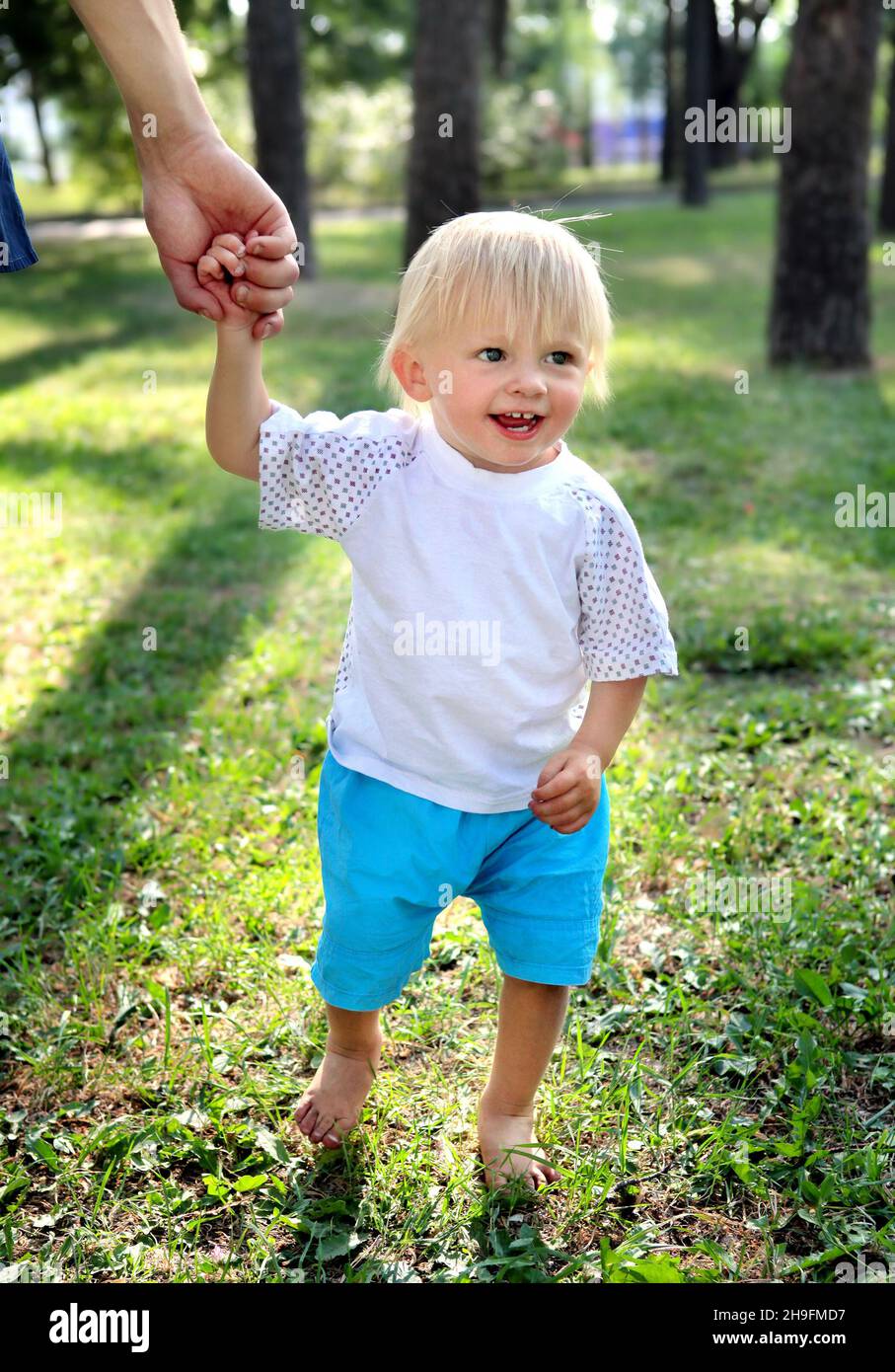 Parent hand hi-res stock photography and images - Alamy