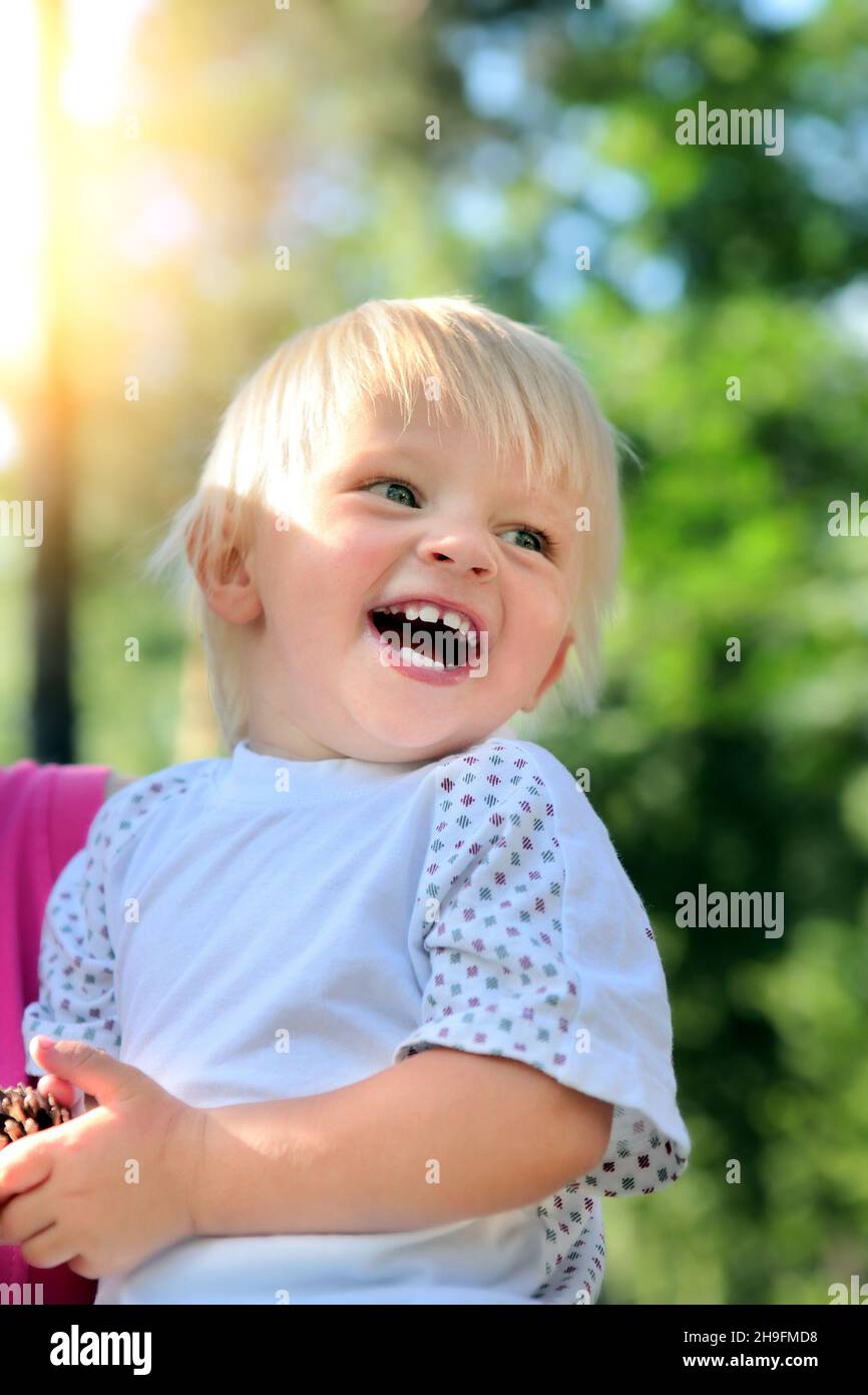 Happy Child laugh in the Summer Park Stock Photo - Alamy