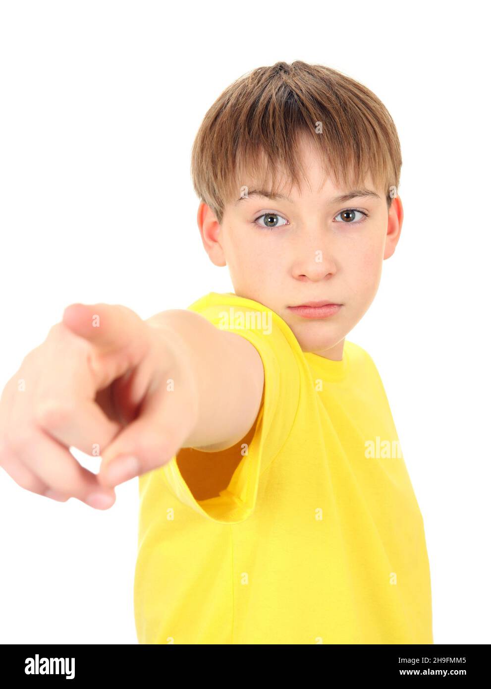 Serious Boy pointing Isolated on the White Background Stock Photo - Alamy