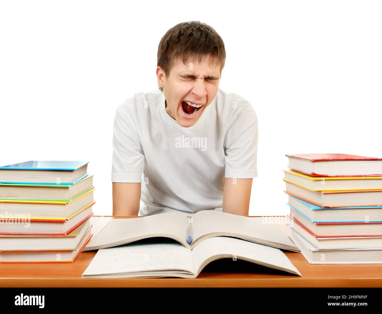 Tired Student Yawning on the School Desk Isolated on the White Stock ...