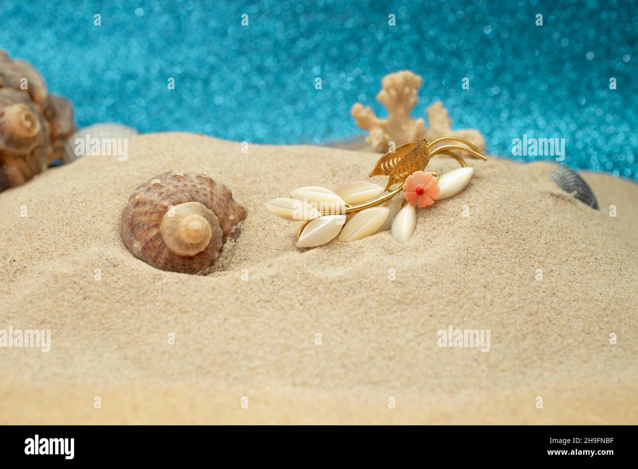 sea side inspired jewelry in the sand, with seashells and coral Stock ...