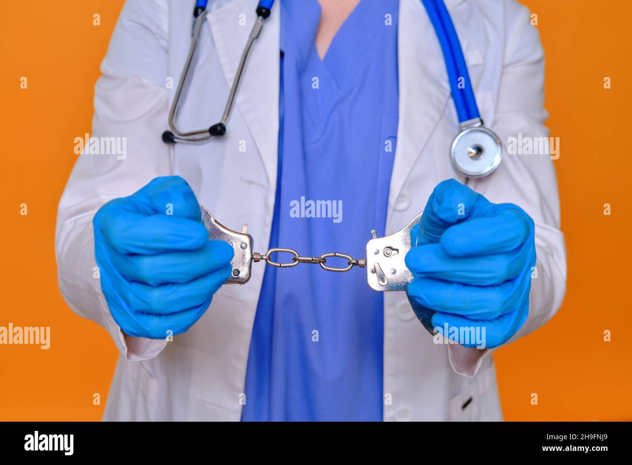 Female hands tied handcuffs hi-res stock photography and images - Alamy
