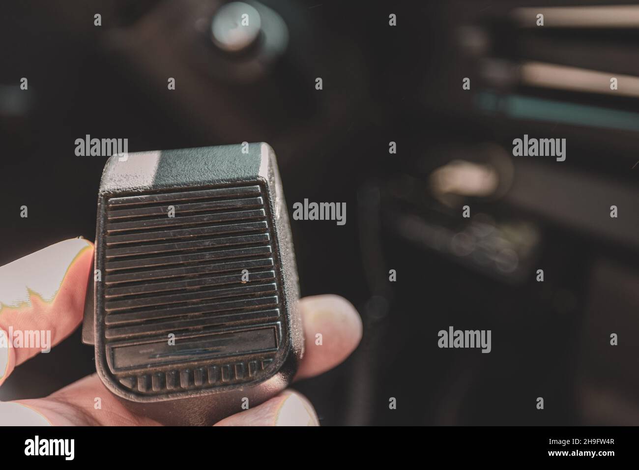 CB microphone held in hand in a van or truck for on the fly ...