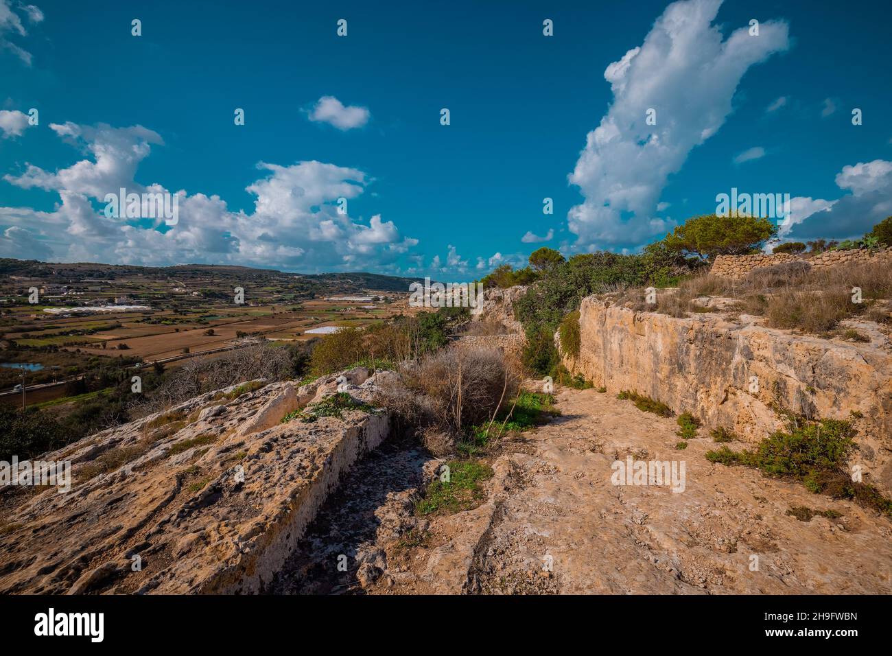 Xemxija heritage trail in eastern part of Malta. View of rocky path ...