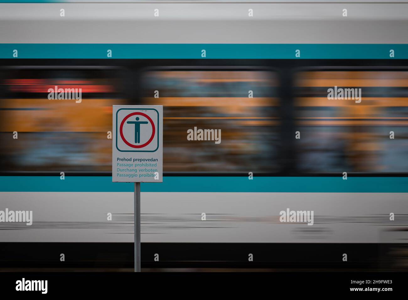 Warning signs for prohibited passage over railway tracks. Metal board ...