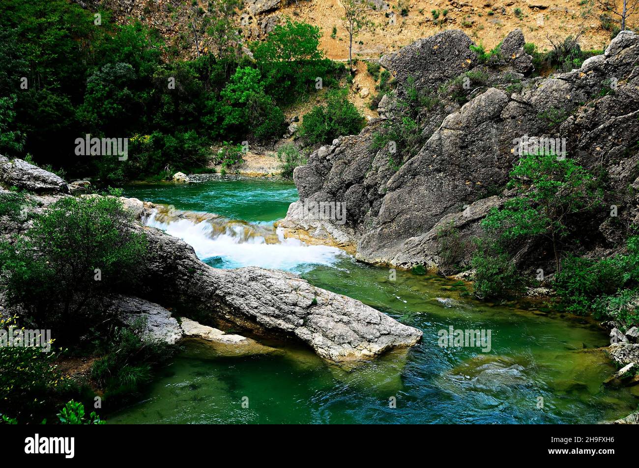 Natural river of water that flows permanently Stock Photo - Alamy