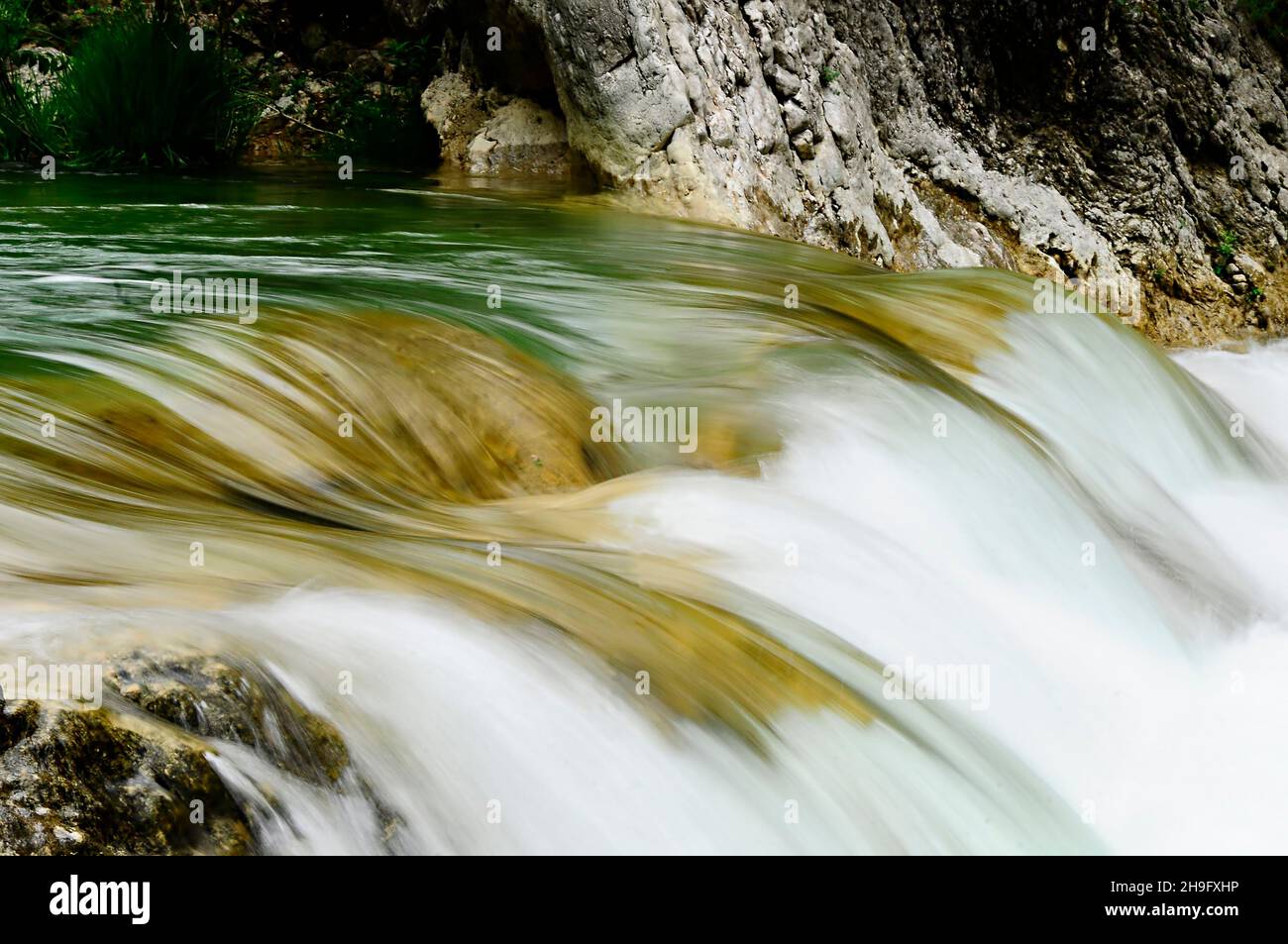 Natural river of water that flows permanently Stock Photo - Alamy