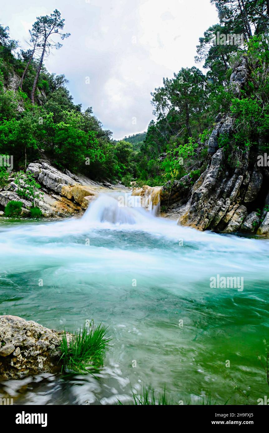 Natural river of water that flows permanently Stock Photo - Alamy