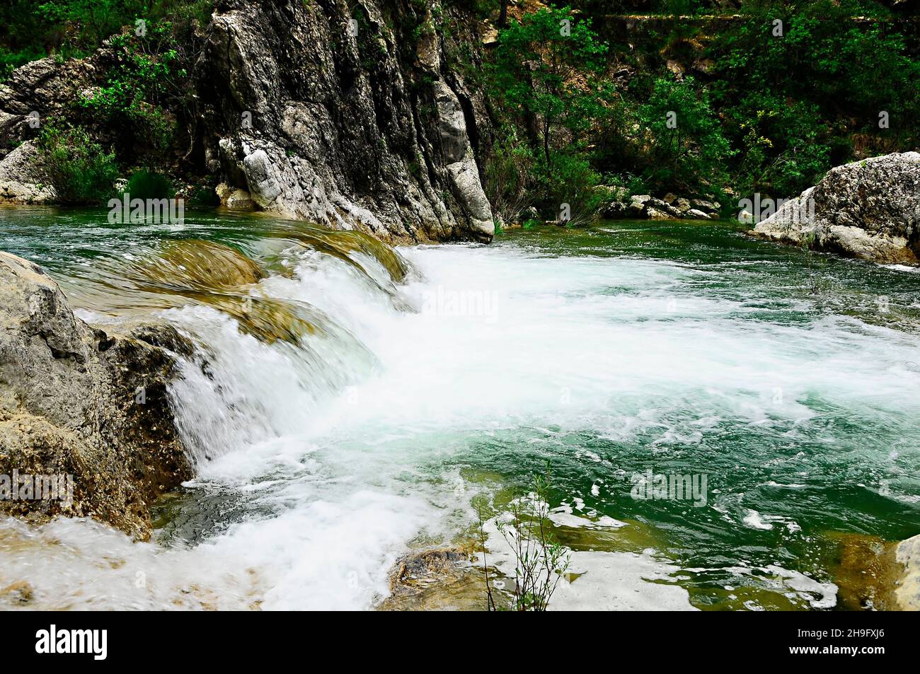 Natural river of water that flows permanently Stock Photo - Alamy