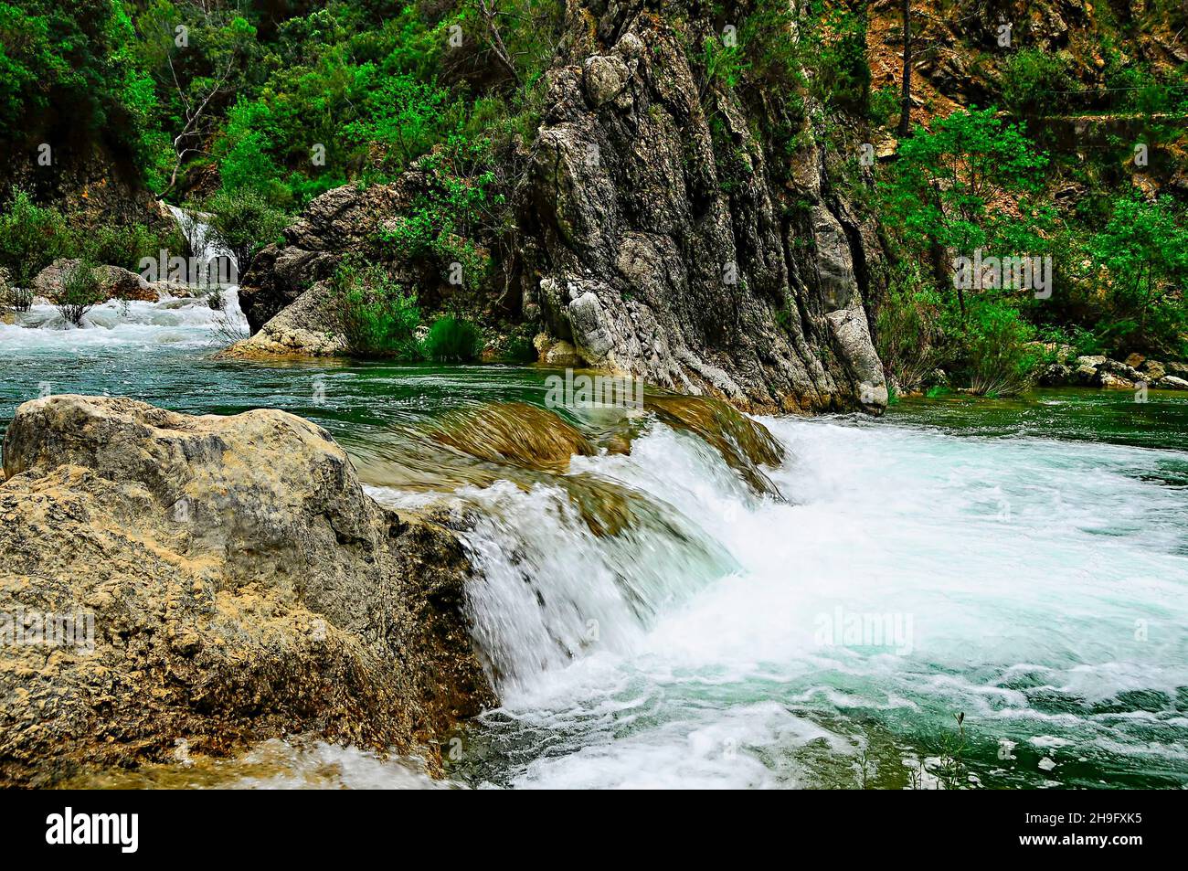 Natural river of water that flows permanently Stock Photo - Alamy