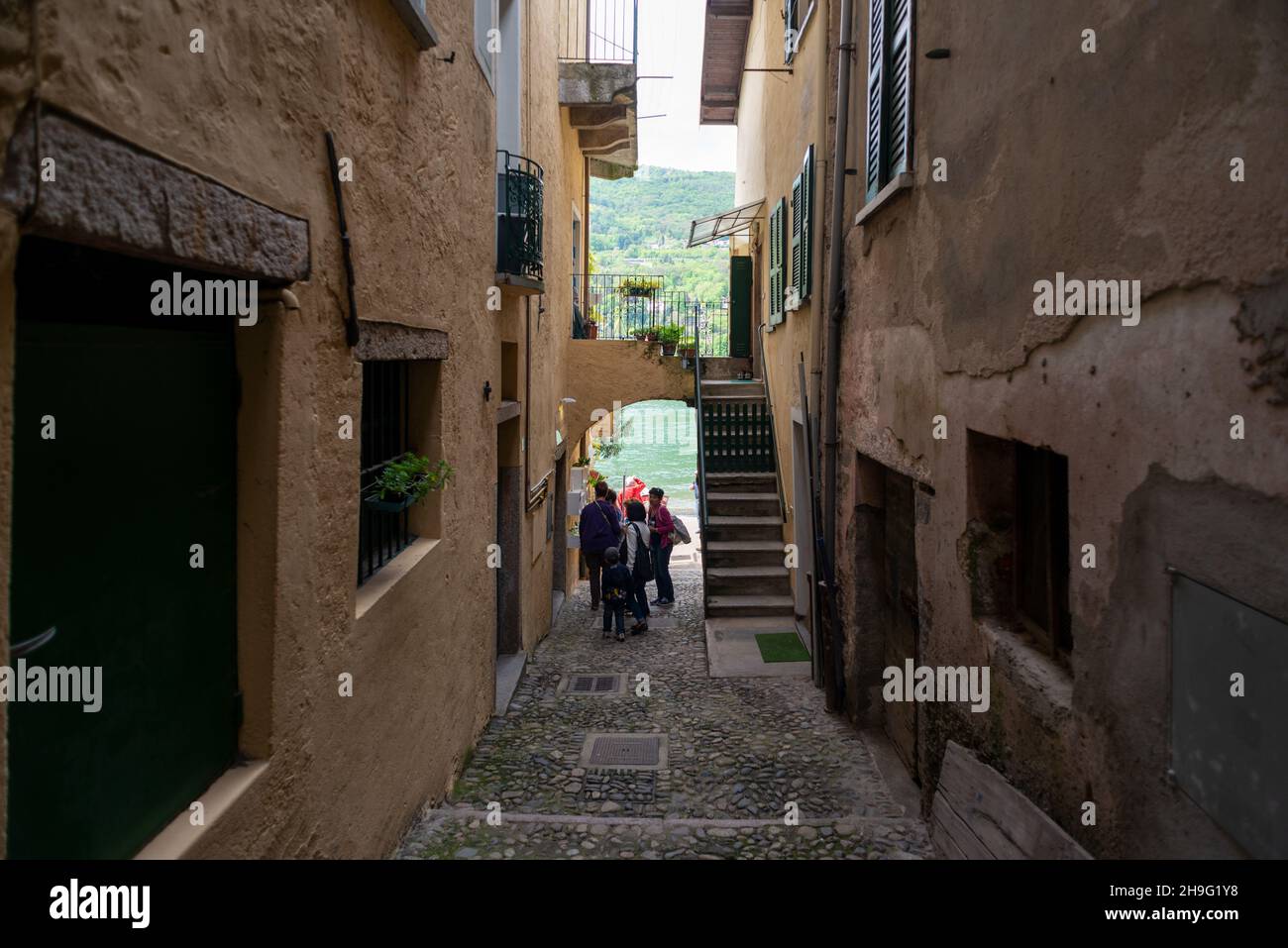 Narrow way between houses Stock Photo - Alamy