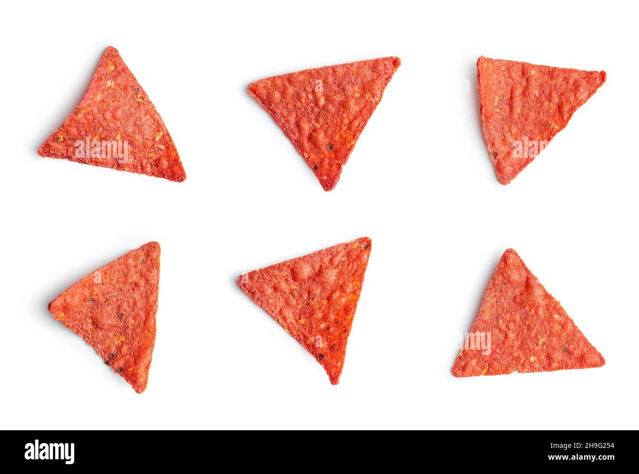 Salted tortilla chips triangle with red beet flavor isolated on white ...