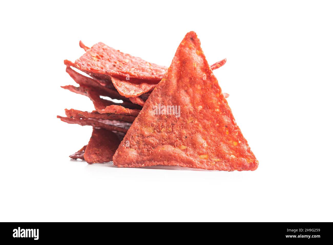 Salted tortilla chips triangle with red beet flavor isolated on white ...