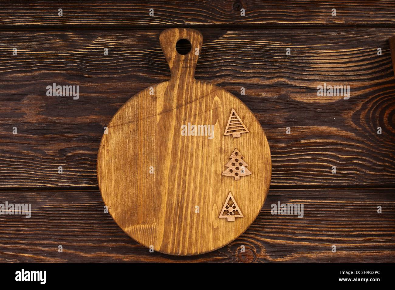 Christmas culinary layout on a wooden background. Wooden cutting board ...