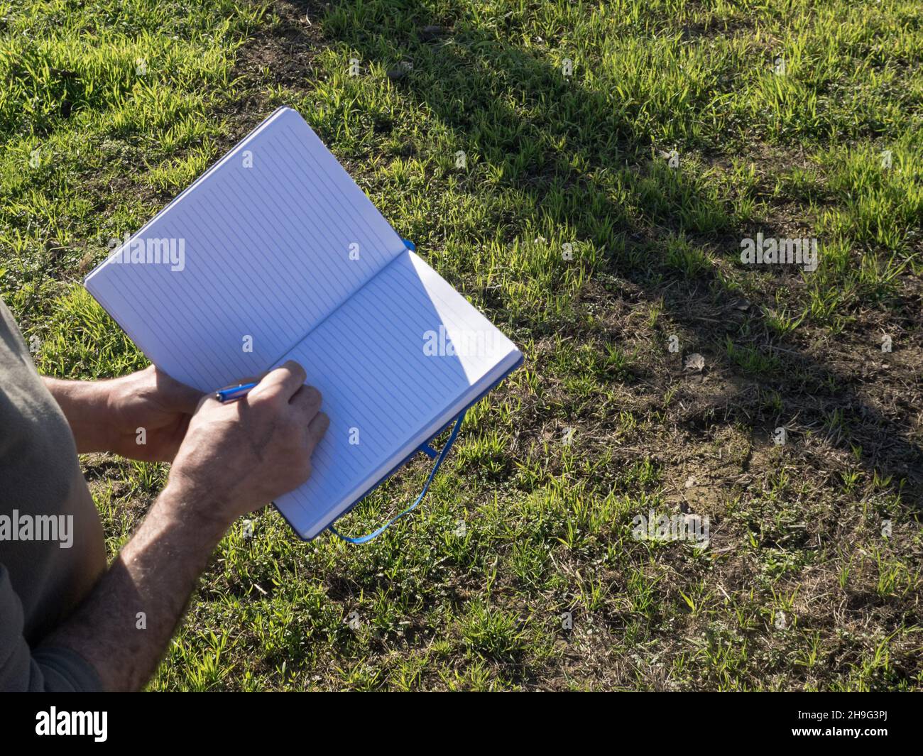 Farmer taking notes in a notebook. The agricultural concept Stock Photo ...
