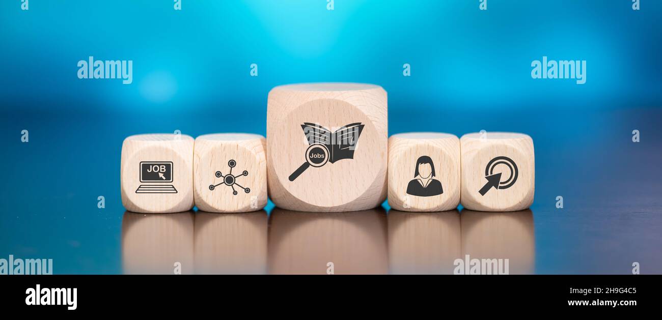 Wooden blocks with symbol of job search concept on blue background ...