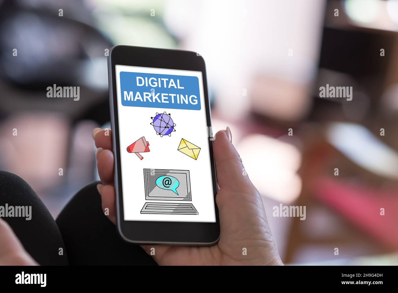 Hand holding a smartphone with digital marketing concept Stock Photo ...