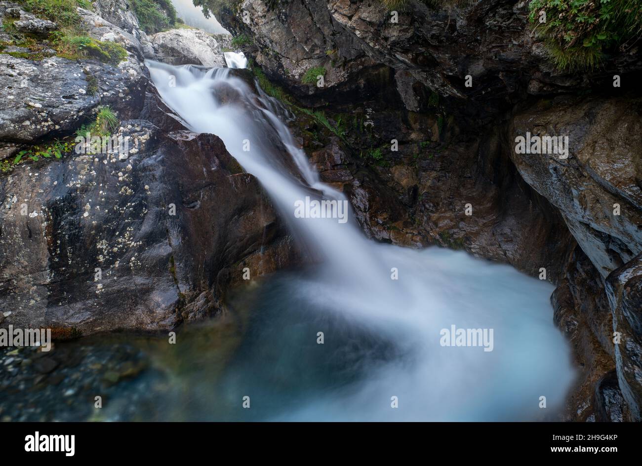Cascades of the waterfall flowing from the ice circus in the French ...
