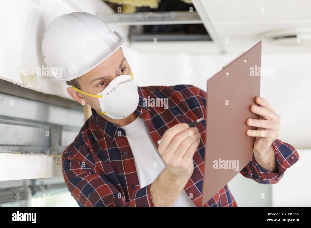 Inspecting a property hi-res stock photography and images - Alamy