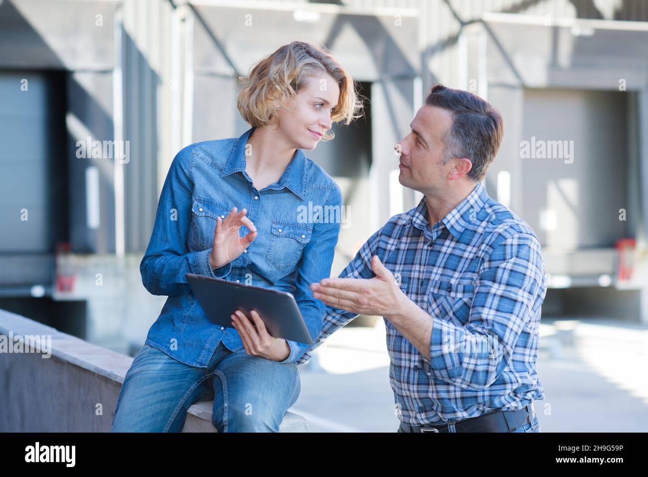 portrait of workers outside factory Stock Photo - Alamy