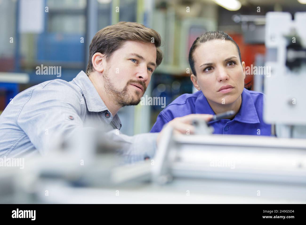 young attractive students of mechatronics working on project Stock ...