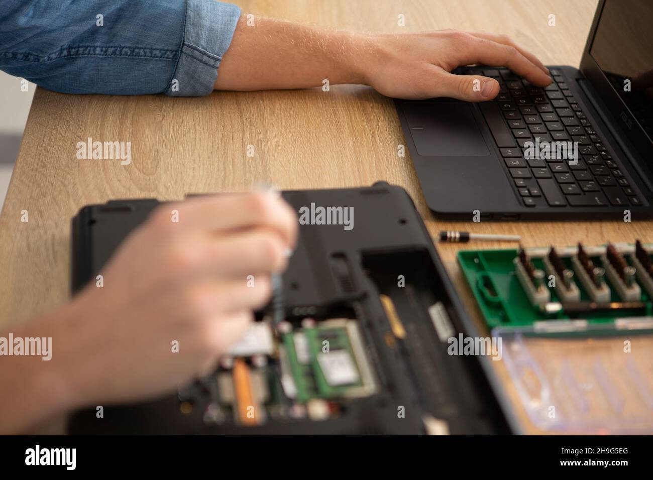an engineer performing laptop maintenance Stock Photo - Alamy