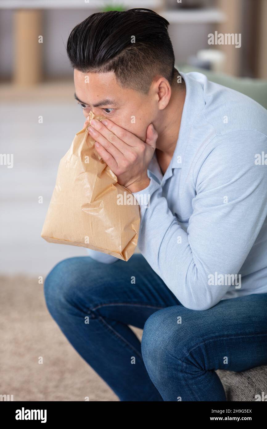 man having panic attack at home Stock Photo - Alamy