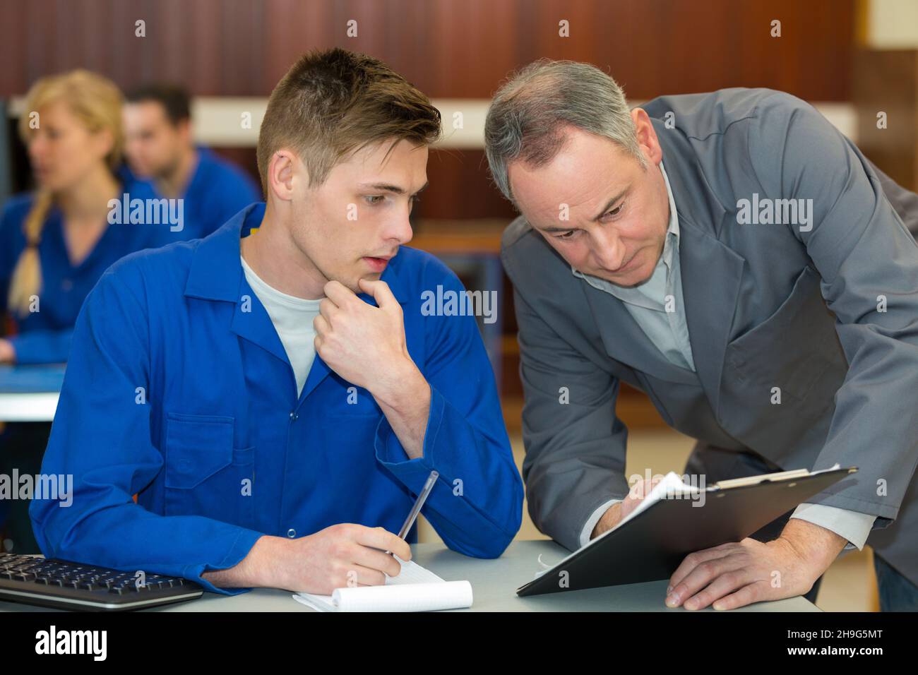 portrait of student mechanic in classroom Stock Photo - Alamy