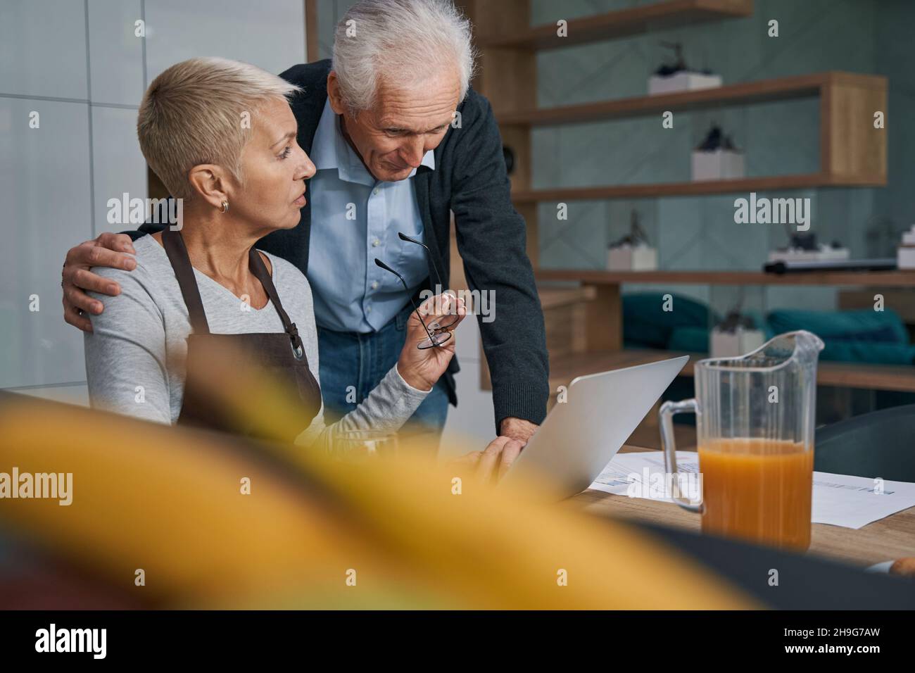 Concentrated senior woman talking to her partner Stock Photo - Alamy