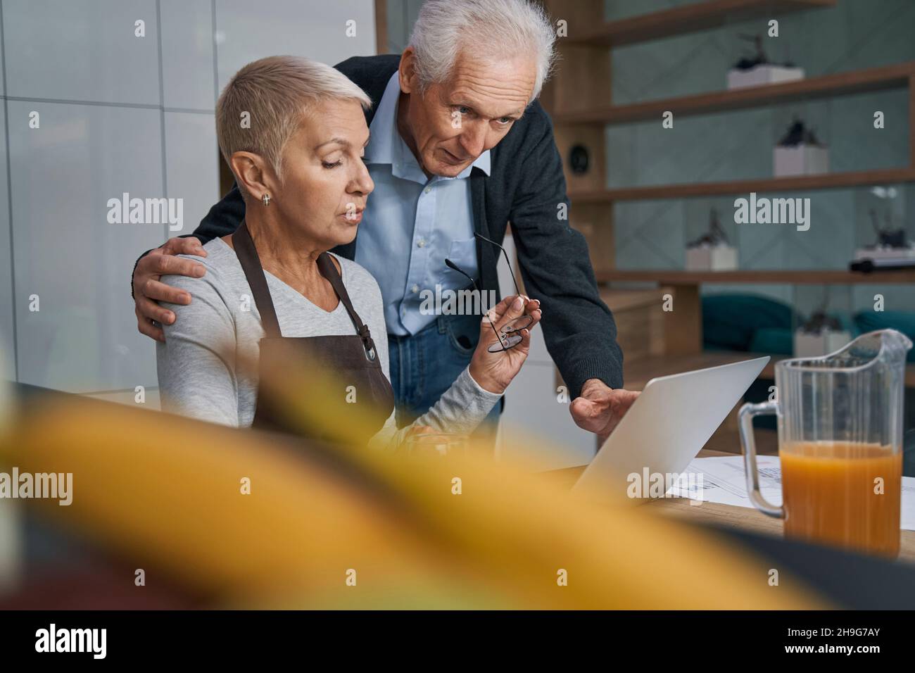 Serious male person pointing at screen of computer Stock Photo - Alamy