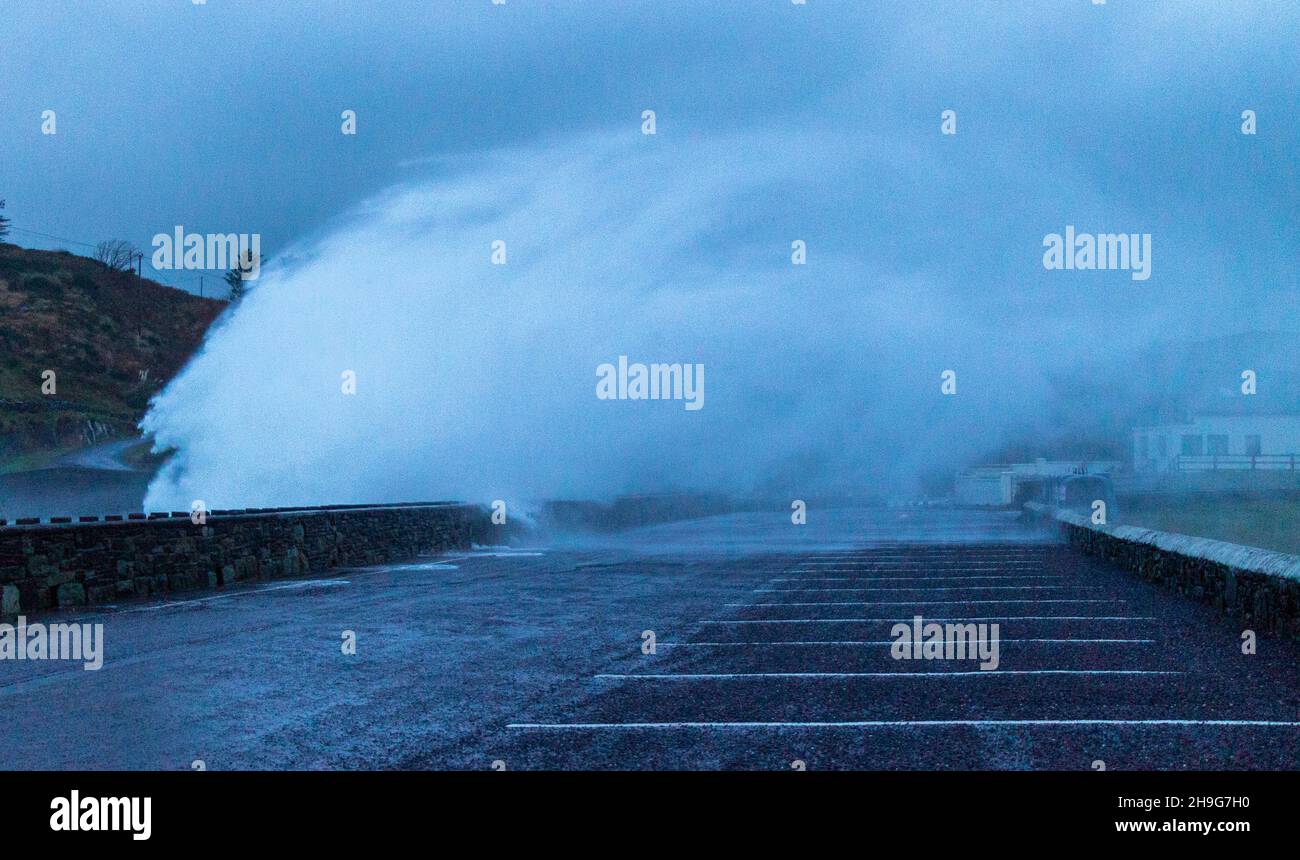 Storm Barra waves breaking over sea defence wall Tragumna West Cork ...