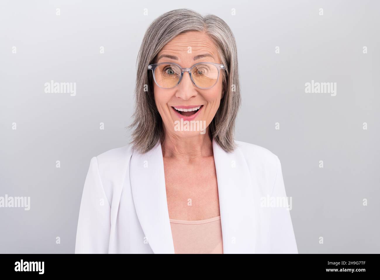 Photo of impressed white hairdo old lady look wear eyewear jacket ...