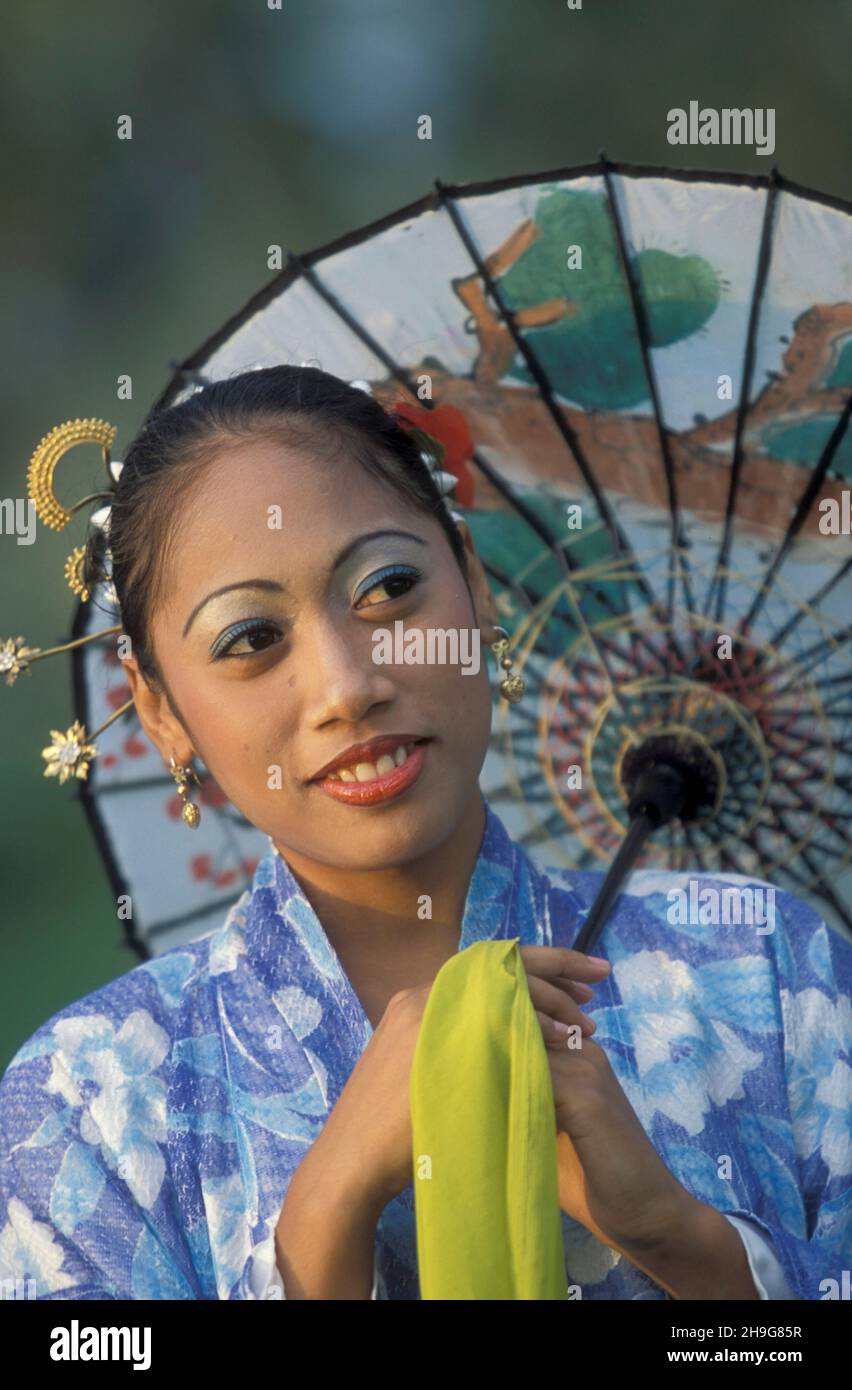 a Women in traditional malay dress in the city of Kuala Lumpur in ...