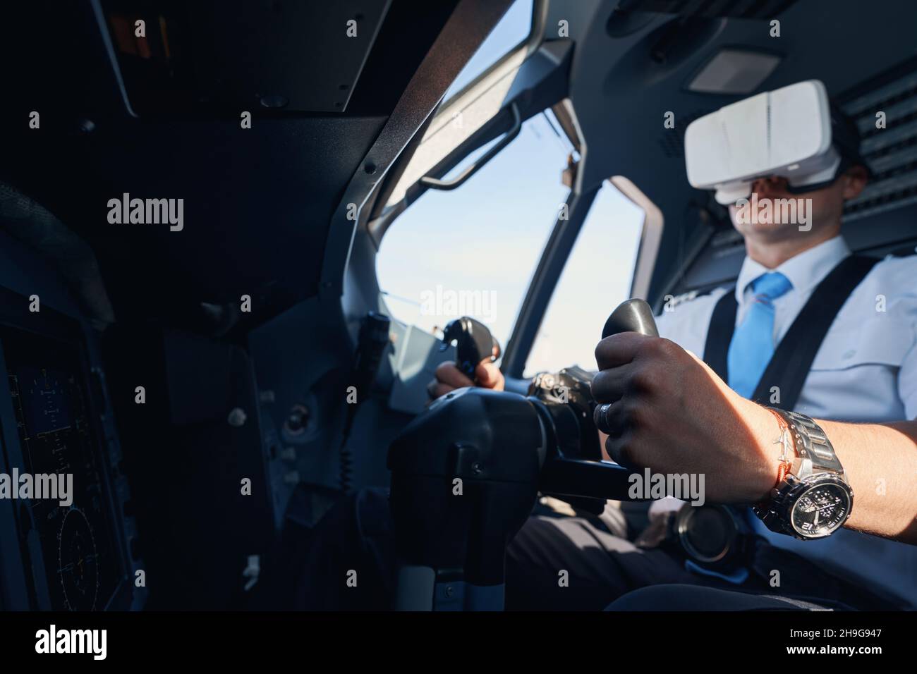 Pilot in augmented reality goggles flying a plane Stock Photo - Alamy