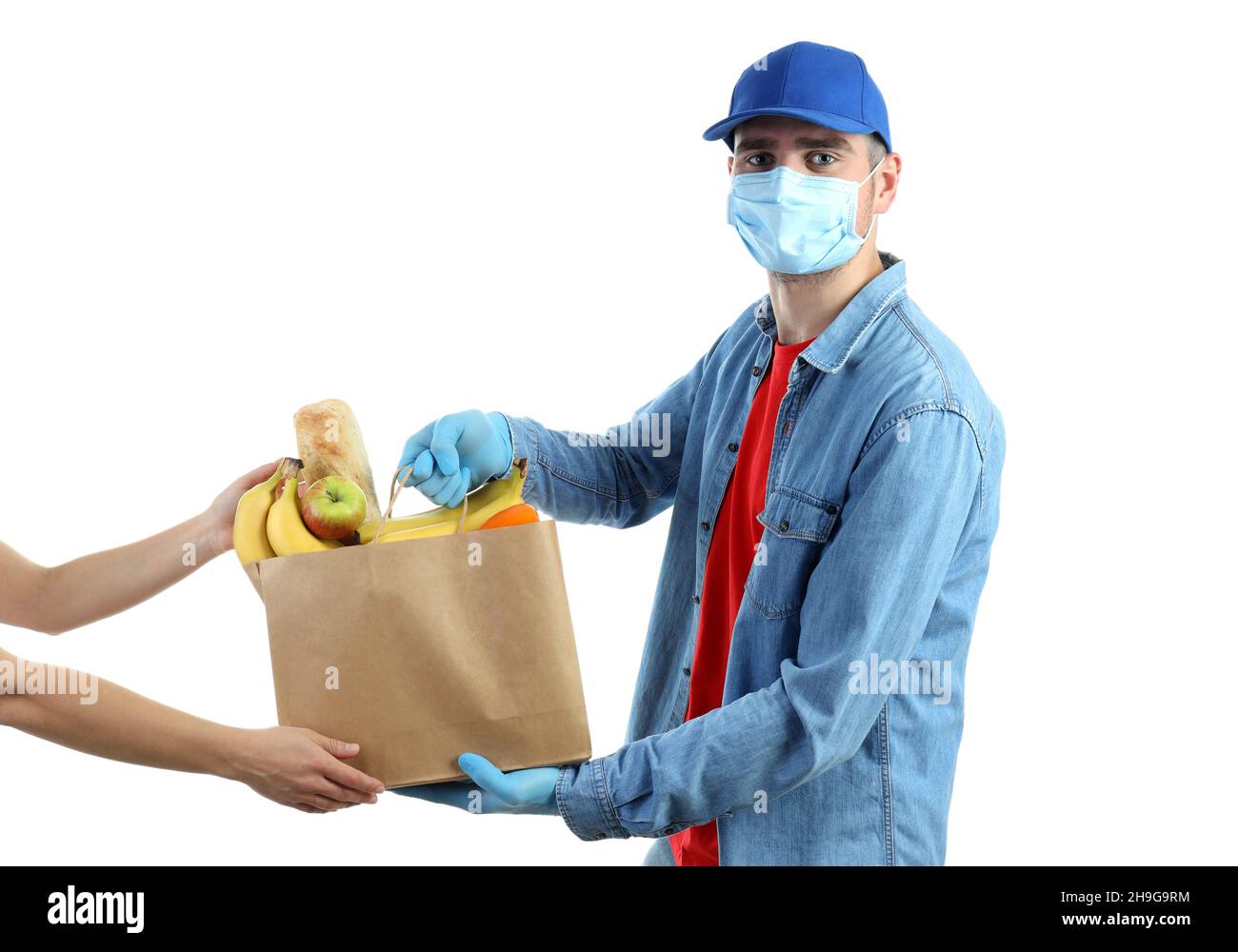 Delivery man give bag with food, isolated on white background Stock ...