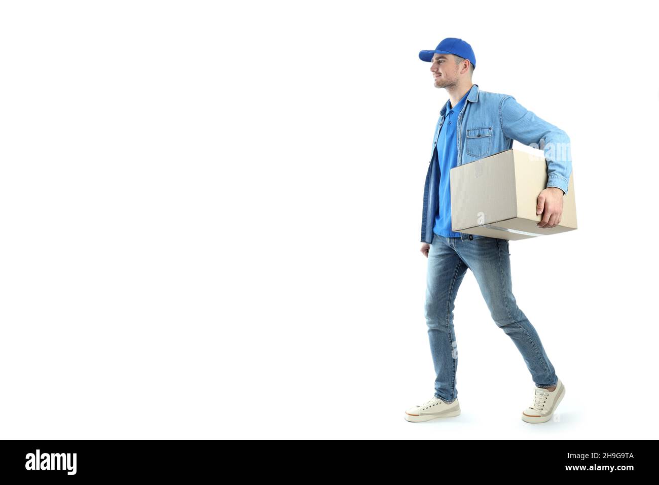 Delivery man walking with a box, isolated on white background Stock ...