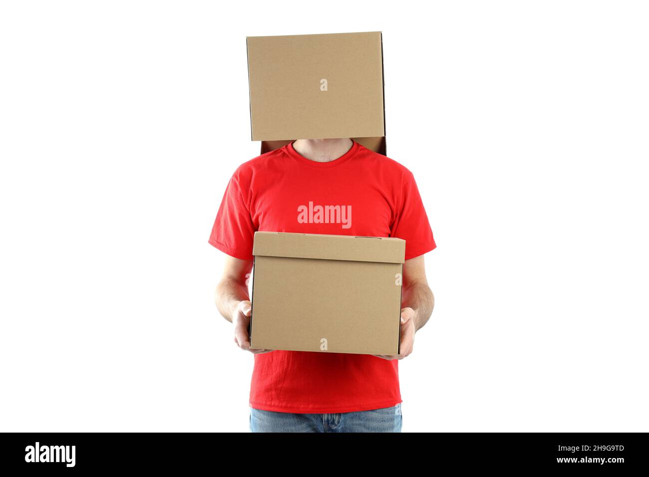 Delivery man with a box on his head and in the hands, isolated on white ...