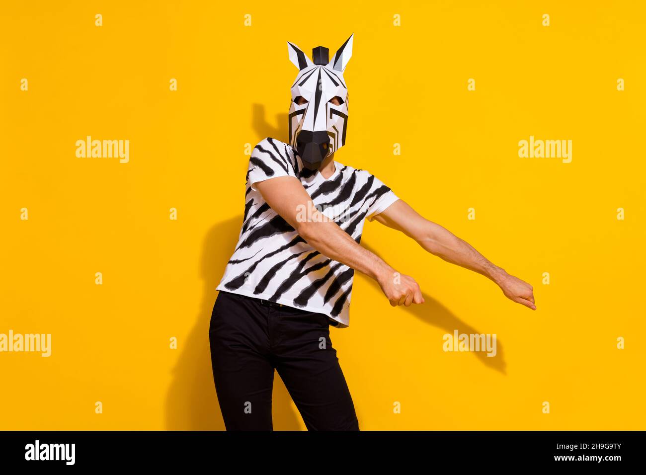 Photo of dynamic weird guy in zebra costume dancing theme festival ...