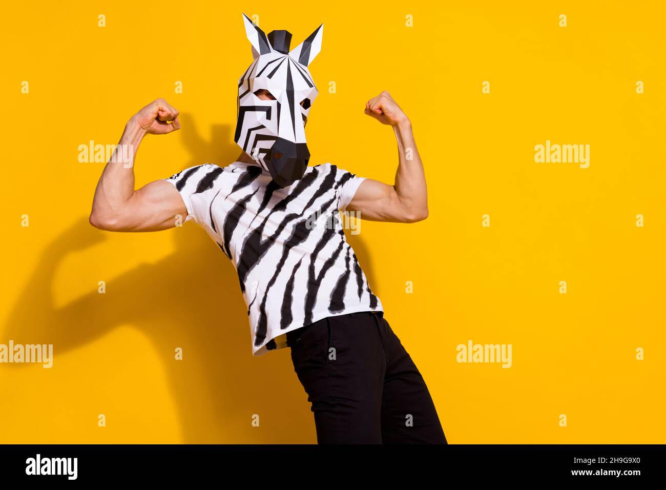 Photo of weird incognito anthropomorphic zebra guy show muscular body ...