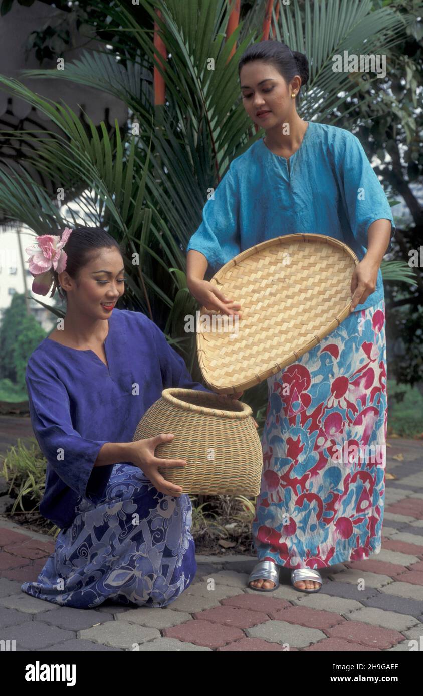 Women in traditional malay dress in the city of Kuala Lumpur in ...