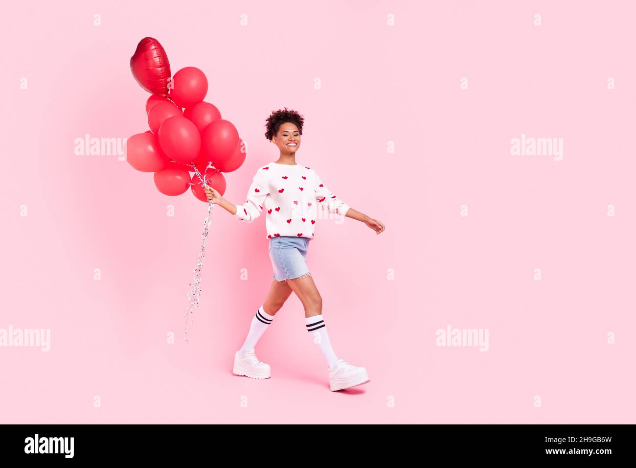 Full size profile side photo of young cheerful woman walk hold many ...