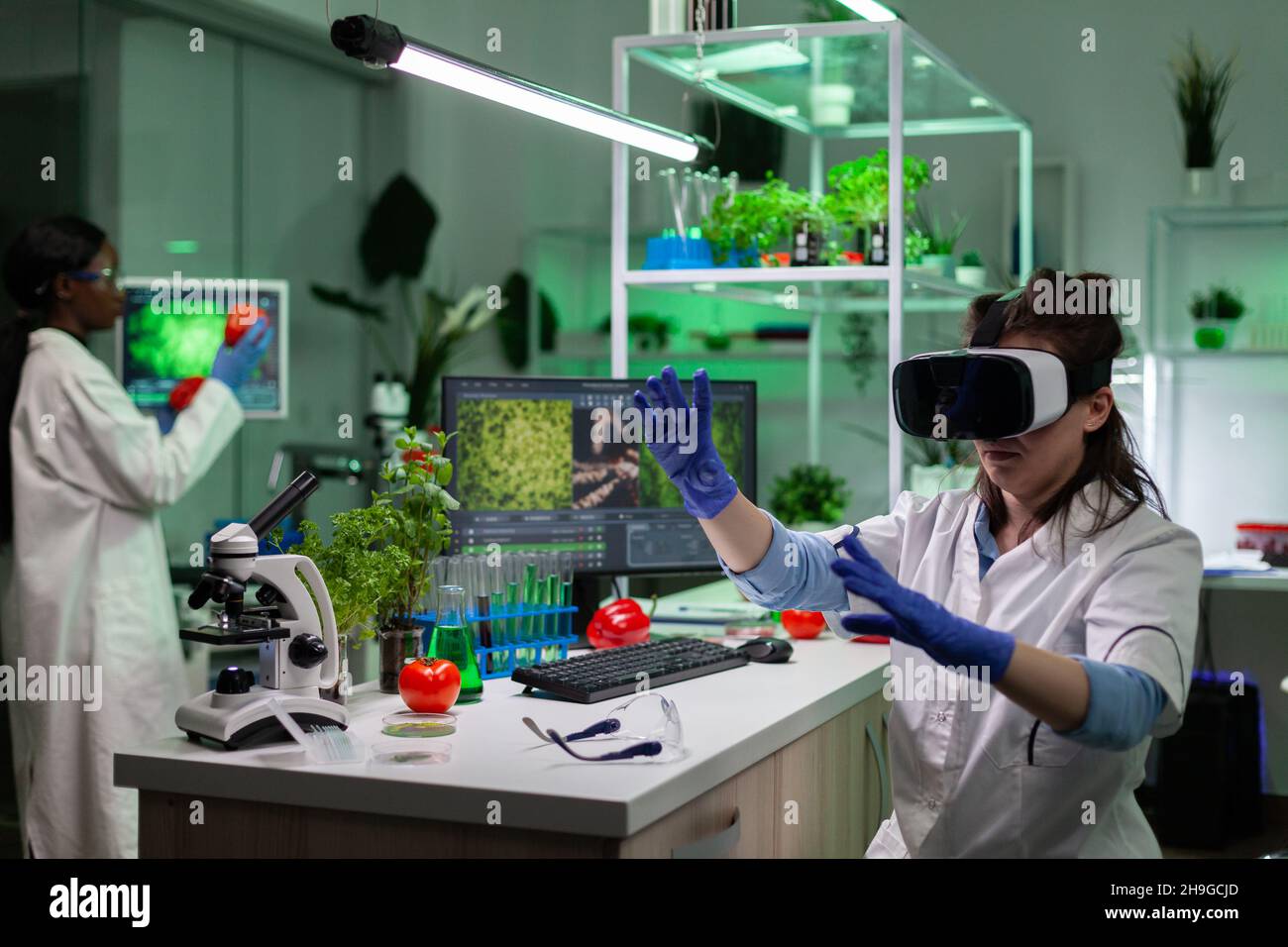 Chemist scientist doctor woman wearing virtual reality headphones ...