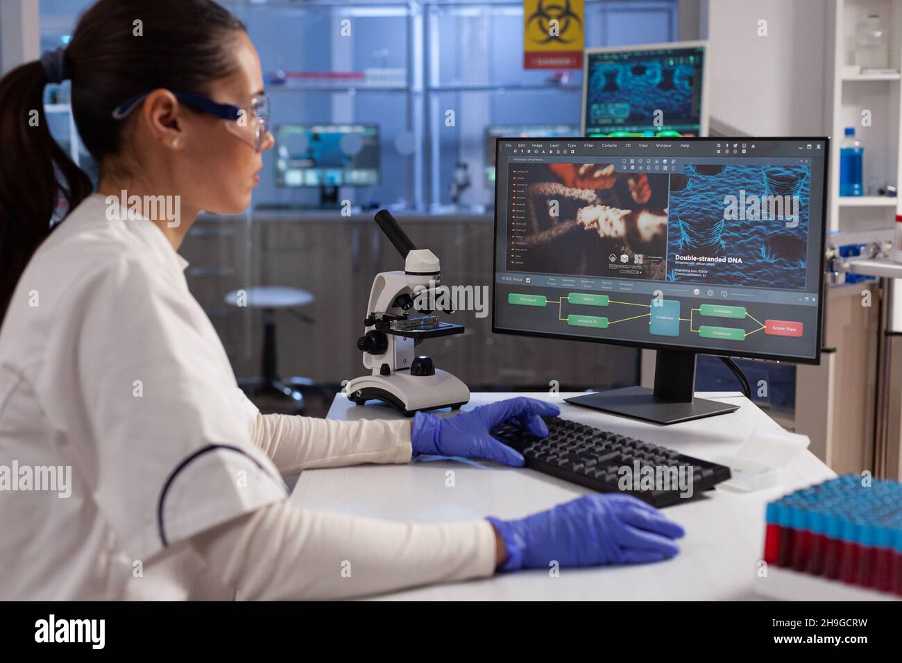 Biochemist woman working at vaccine developing typing medical expertise ...