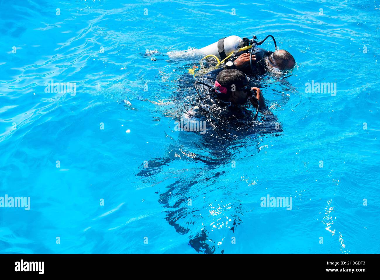 Learning process of scuba diving. Experienced instructor teaches ...