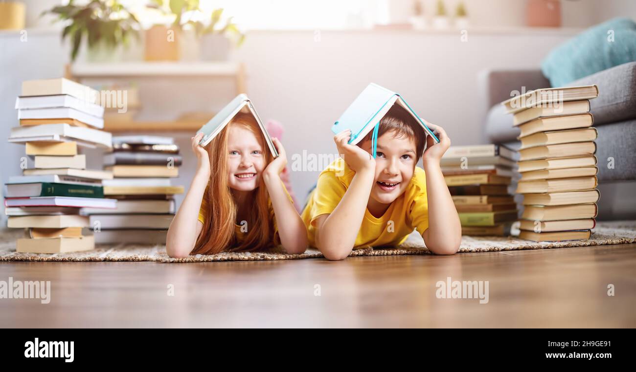 Children laughing while reading story hi-res stock photography and ...